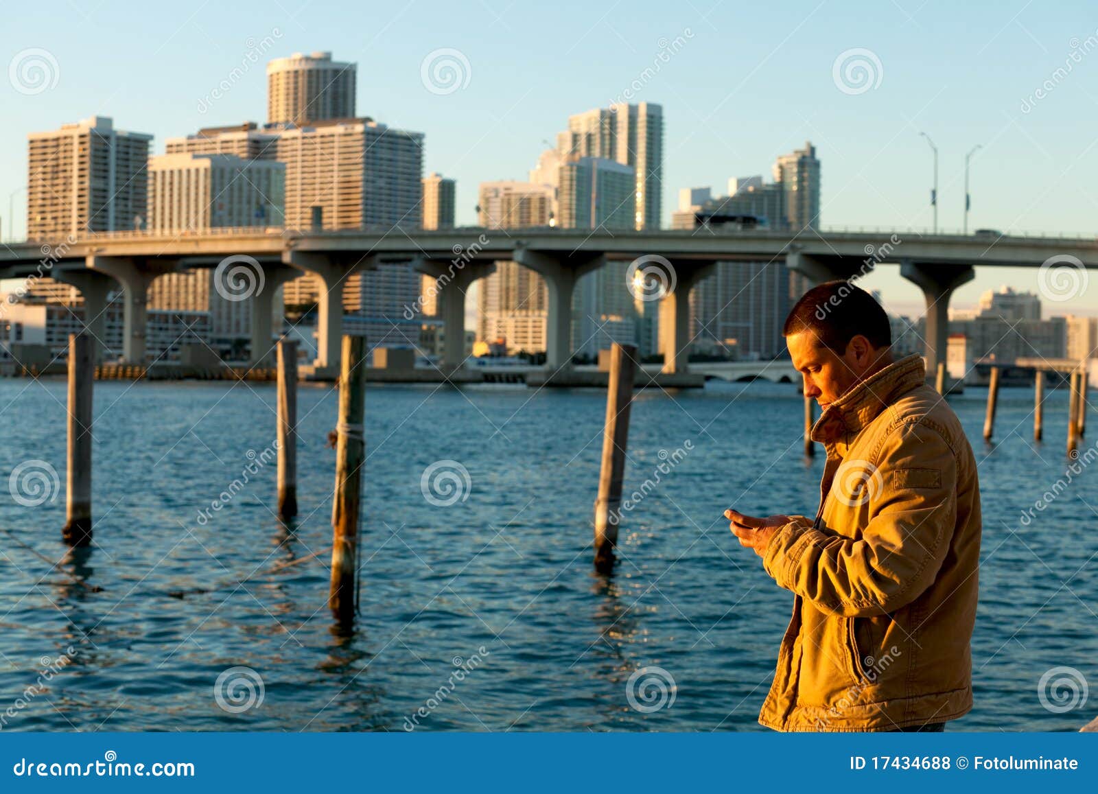 Handsome Man Texting on a Mobile Phone Stock Photo - Image of male ...