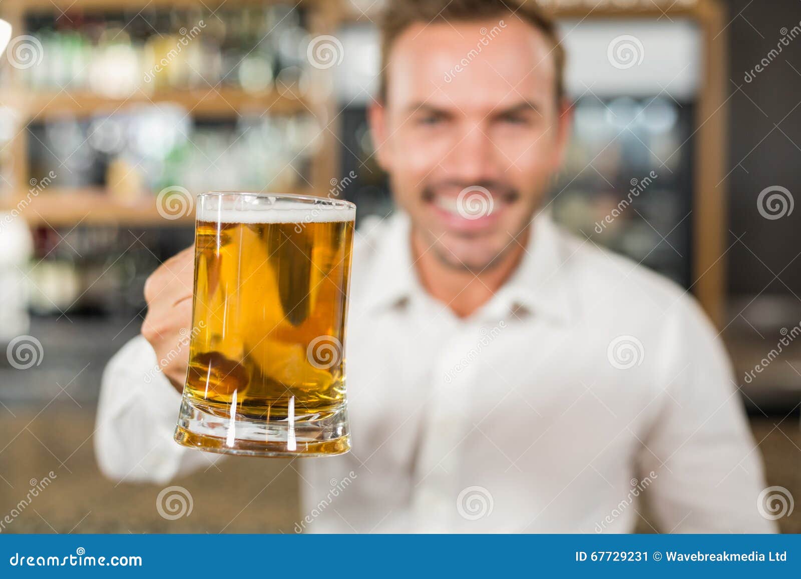 Handsome man toasting stock image. Image of sitting, caucasian - 67729231