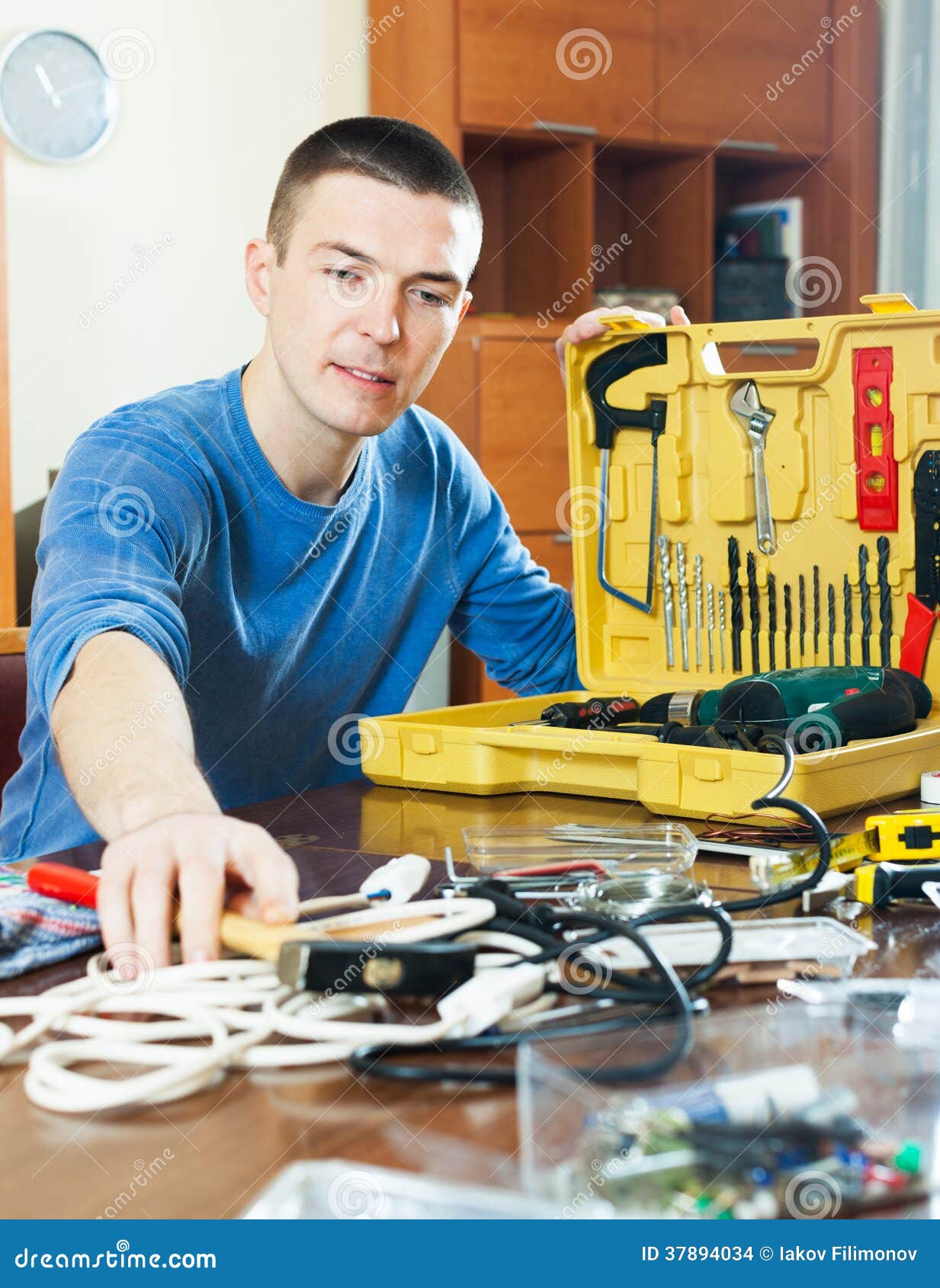 Handsome Man with Toolbox Reaching for Hammer Stock Photo - Image of ...