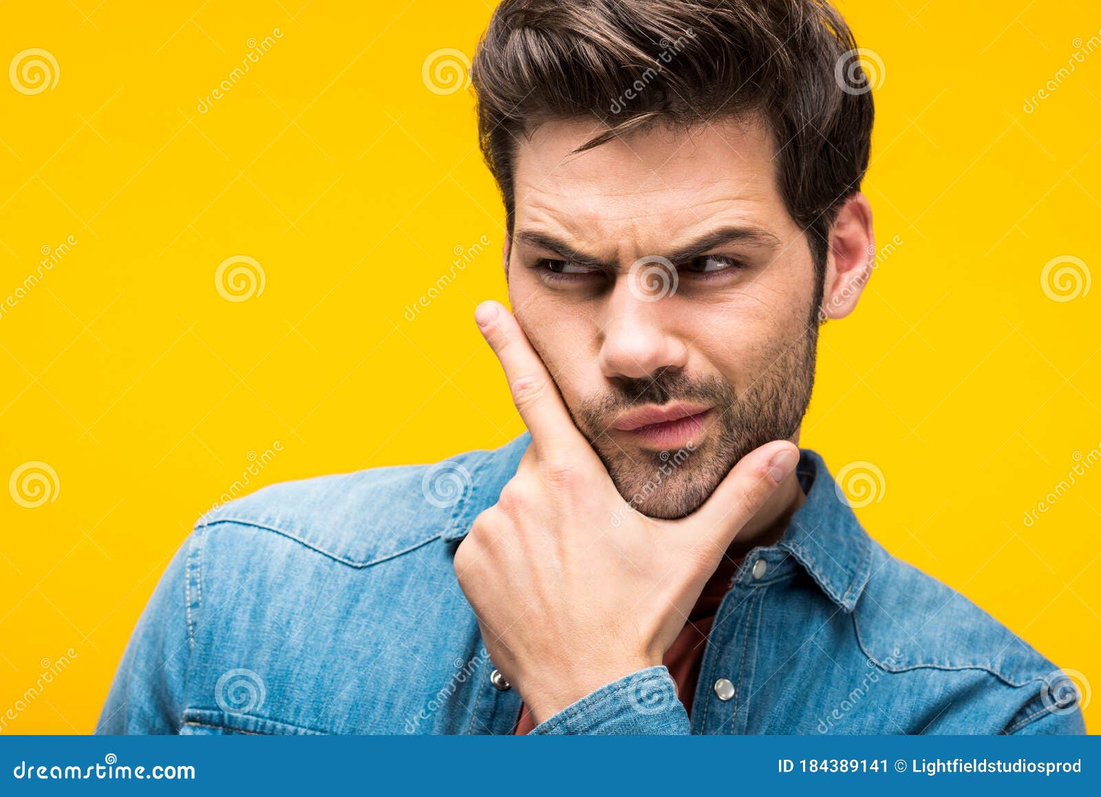 Handsome Man Touching Chin Isolated on Yellow Stock Image - Image of ...