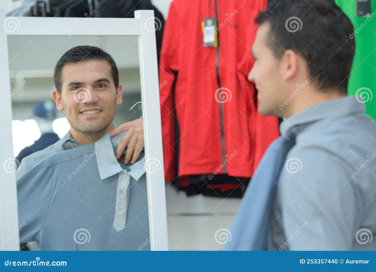 Handsome Man Trying on Clothes in Shopping Stock Photo - Image of life ...