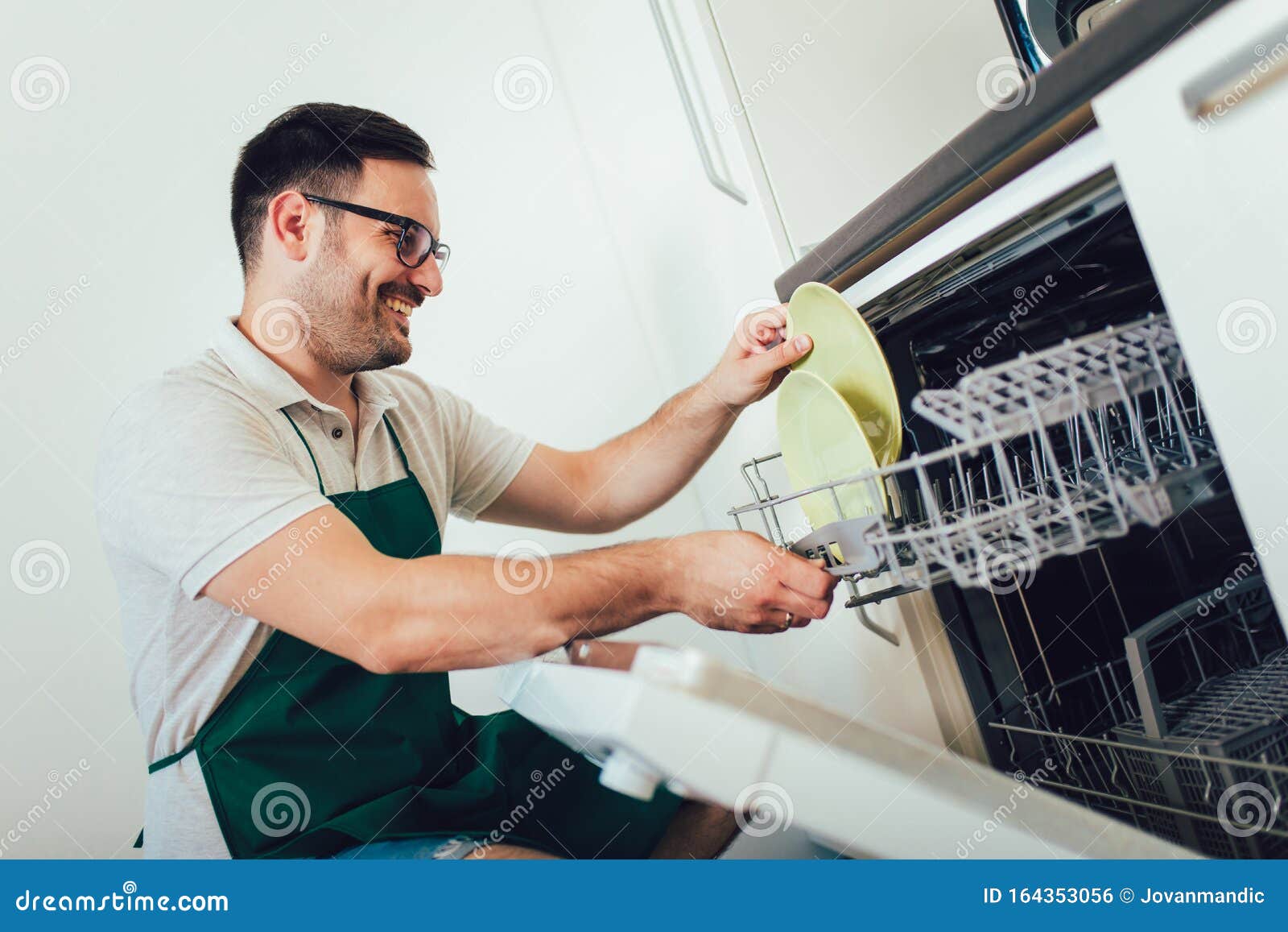Handsome Man Unloading Dishwasher and Enjoying in Housework Stock Photo ...