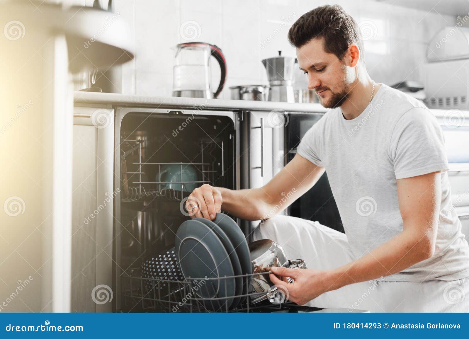 Man Unloading Dishwasher And Enjoying In Housework. Royalty-Free Stock ...
