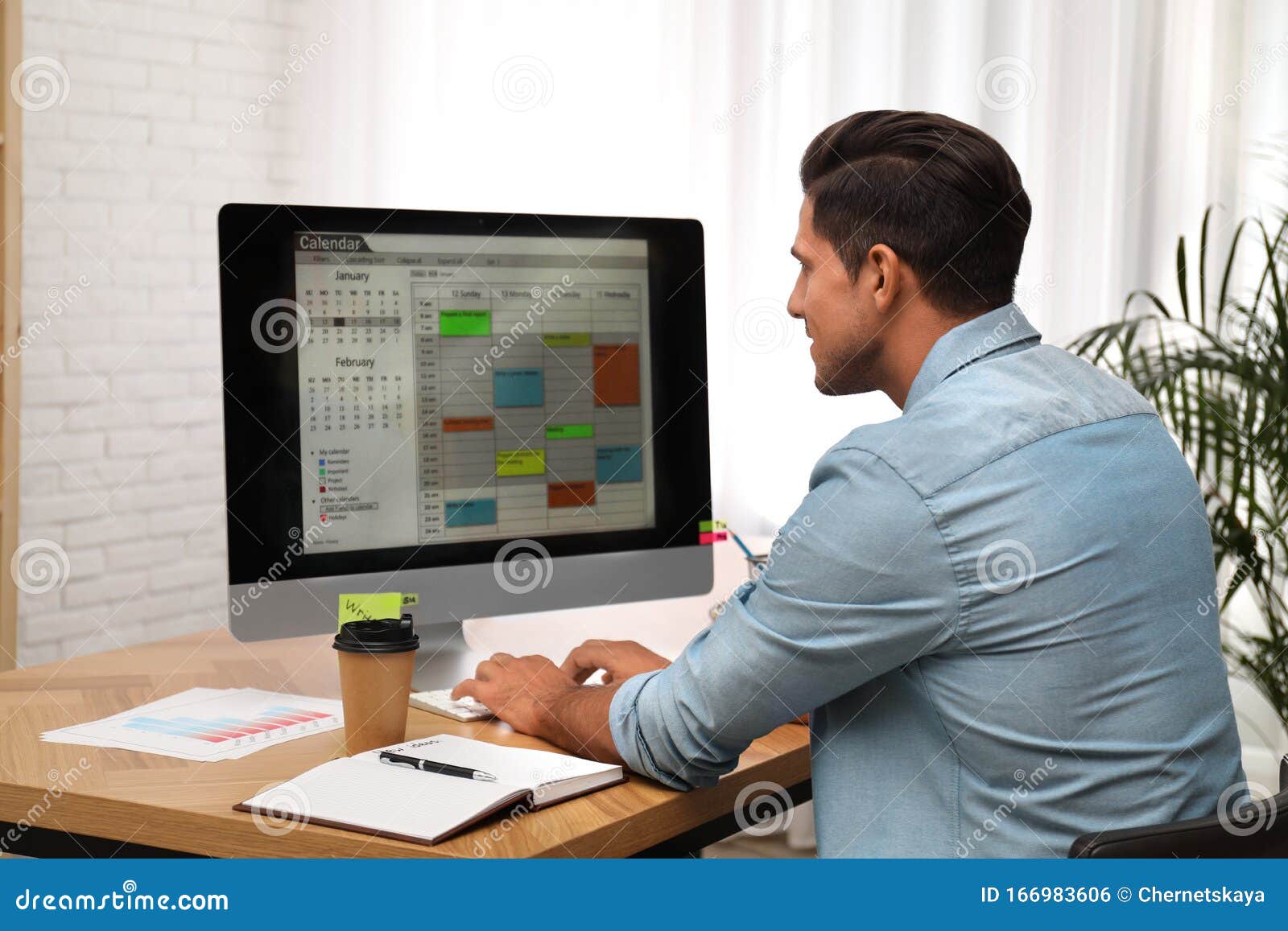 Handsome Man Using Calendar App on Computer Stock Photo - Image of ...