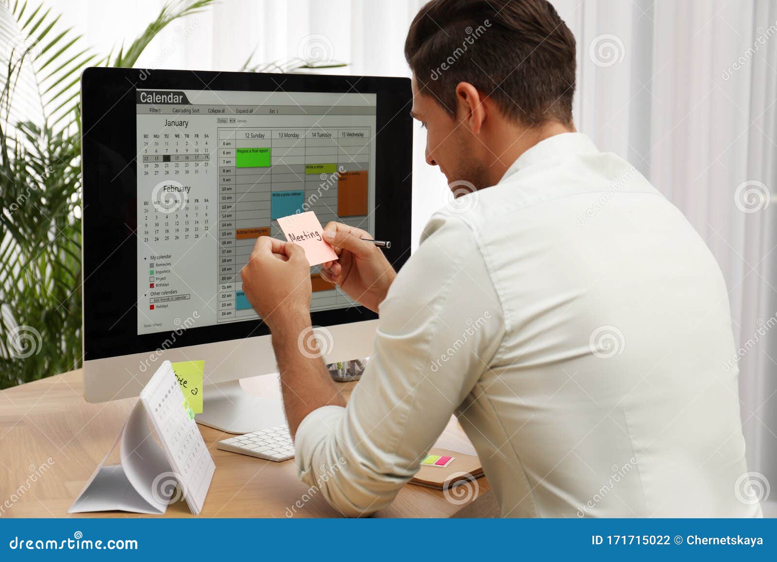 Handsome Man Using Calendar App on Computer Stock Photo - Image of ...