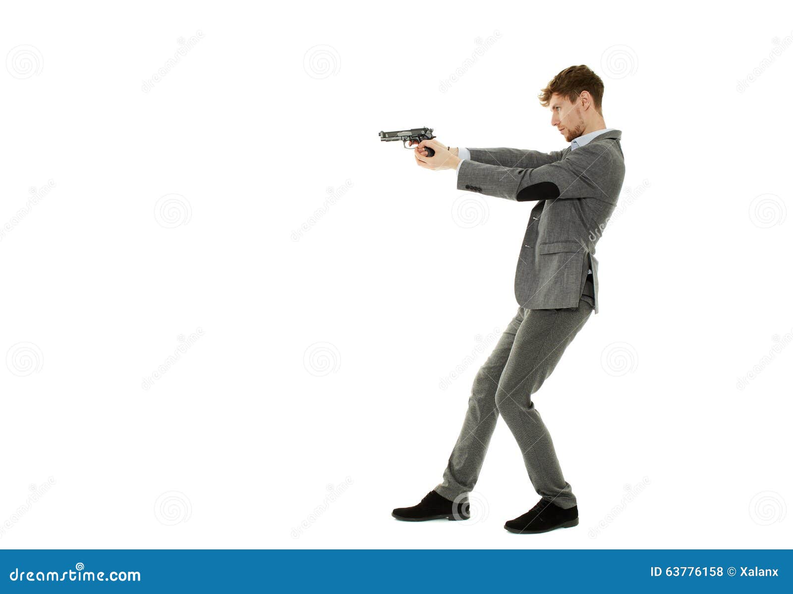 Handsome man using a gun stock photo. Image of adult - 63776158