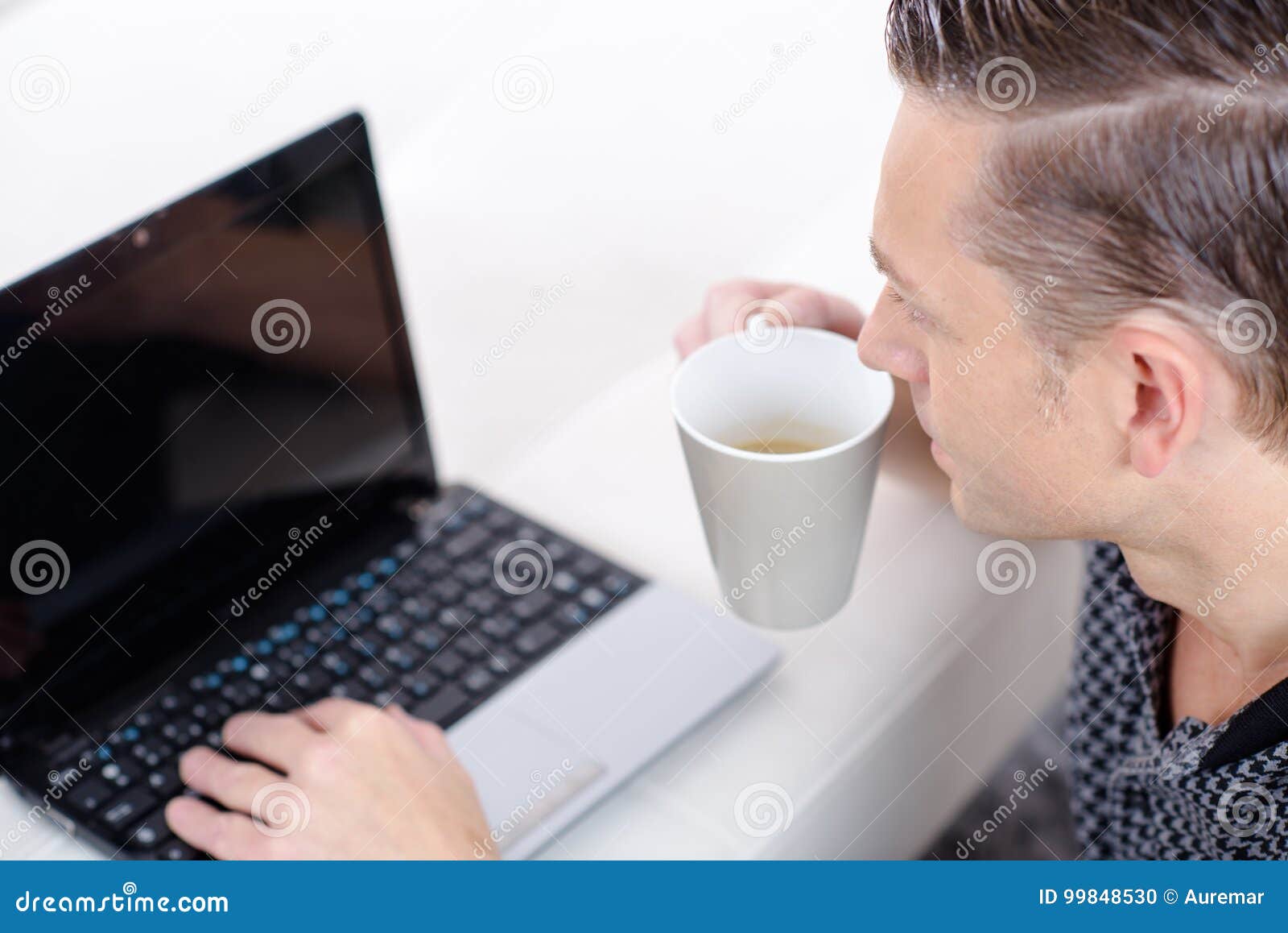 Handsome Man Using Laptop while Having Coffee Stock Photo - Image of ...