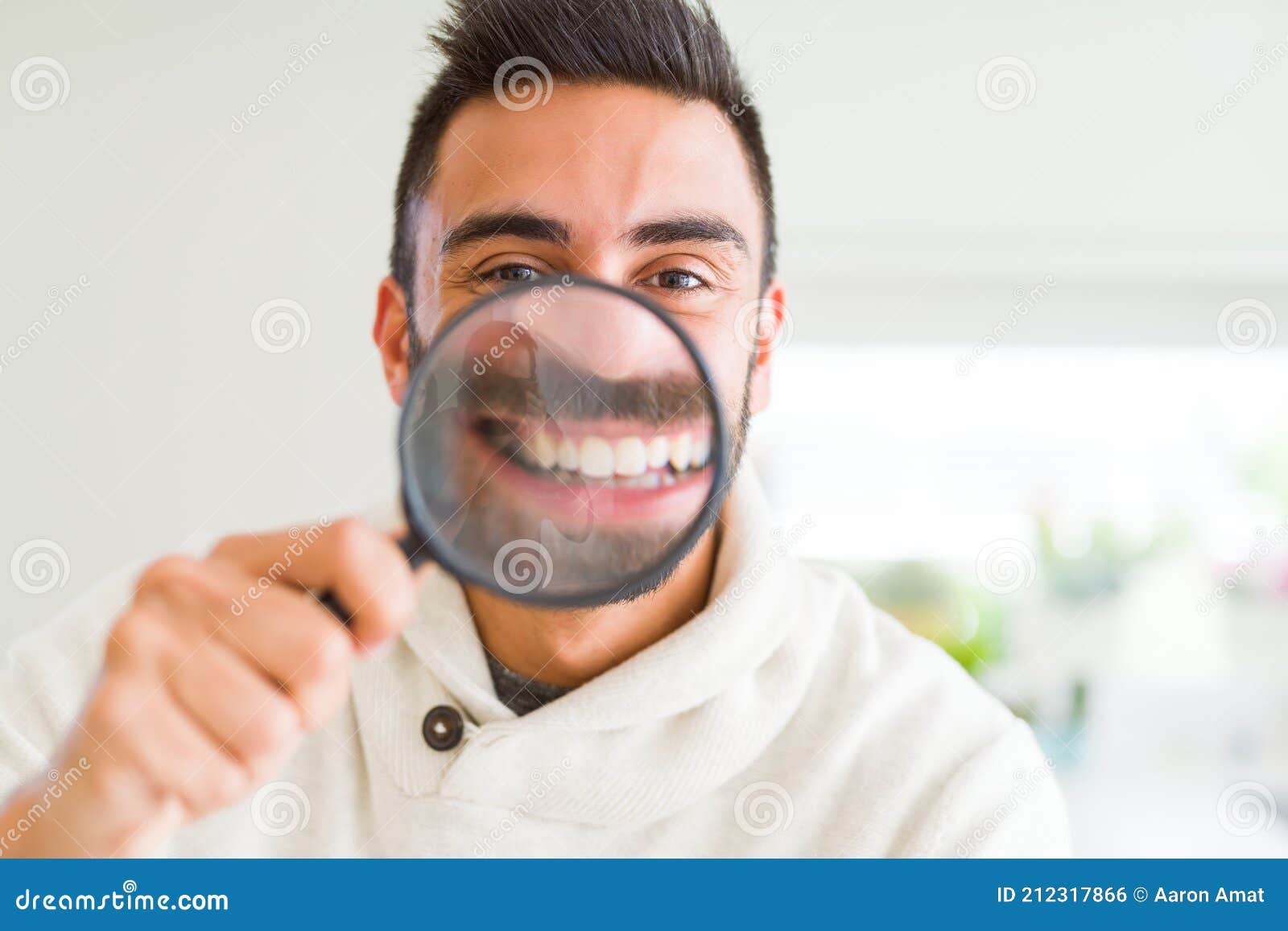 Handsome Man Using Magnifying Glass, Doing Funny Faces Stock Photo ...