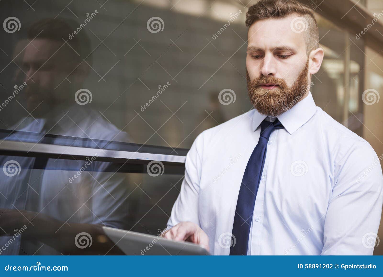 Handsome man using tablet stock photo. Image of built - 58891202