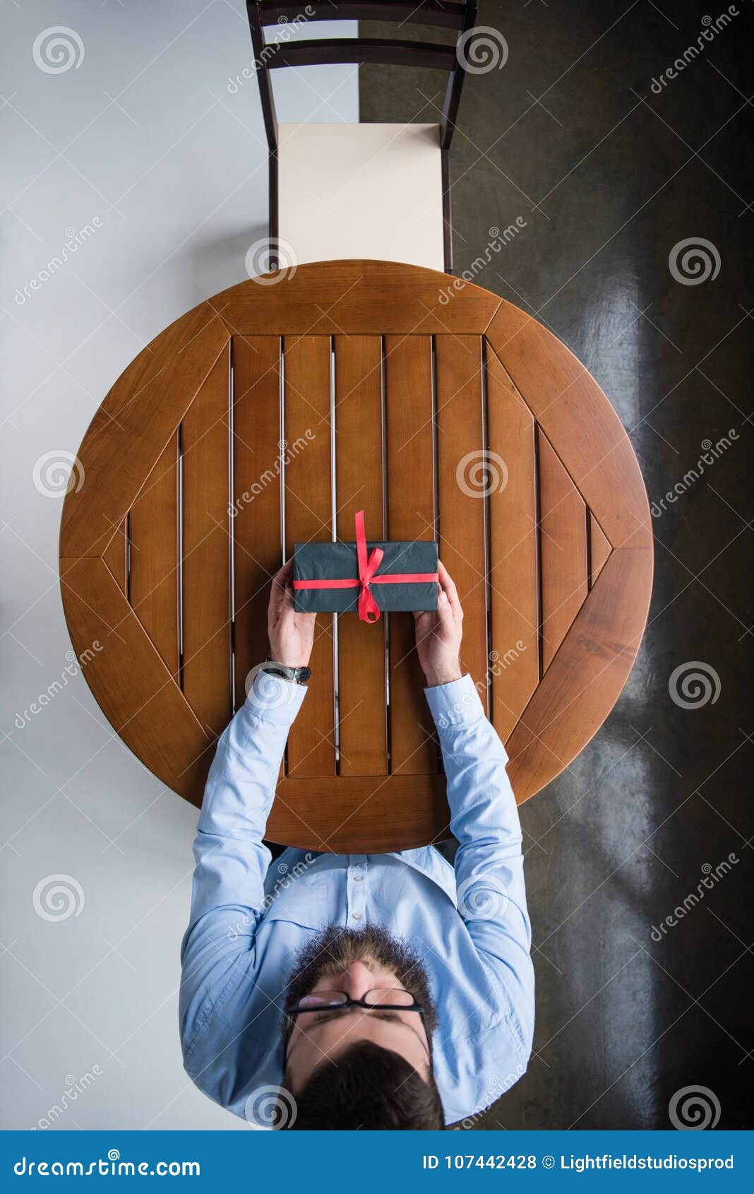Handsome Man Waiting at Cafe with Present in Box Stock Photo - Image of ...