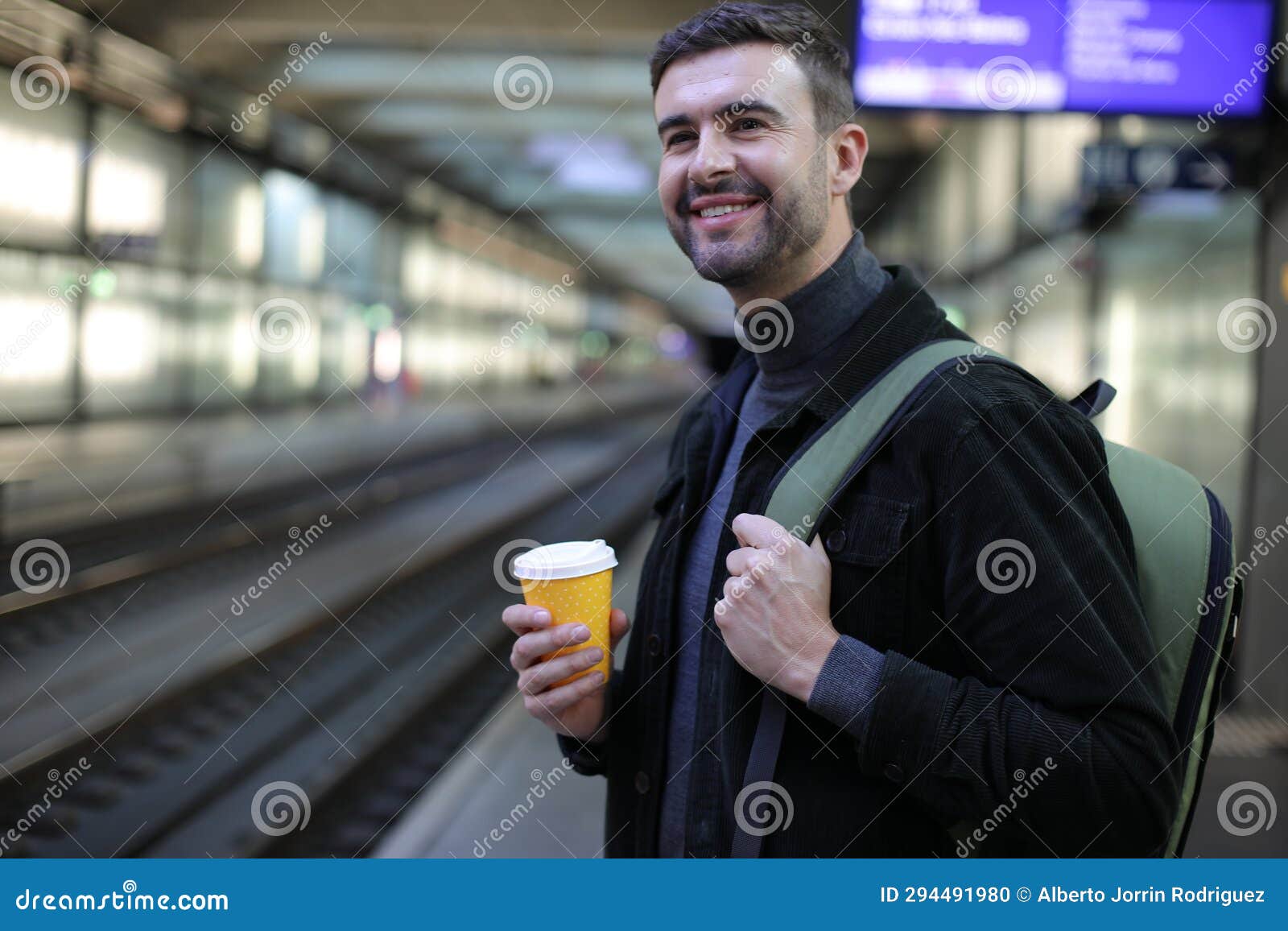 Handsome Man Waiting for a Train with Coffee Cup Stock Photo - Image of ...