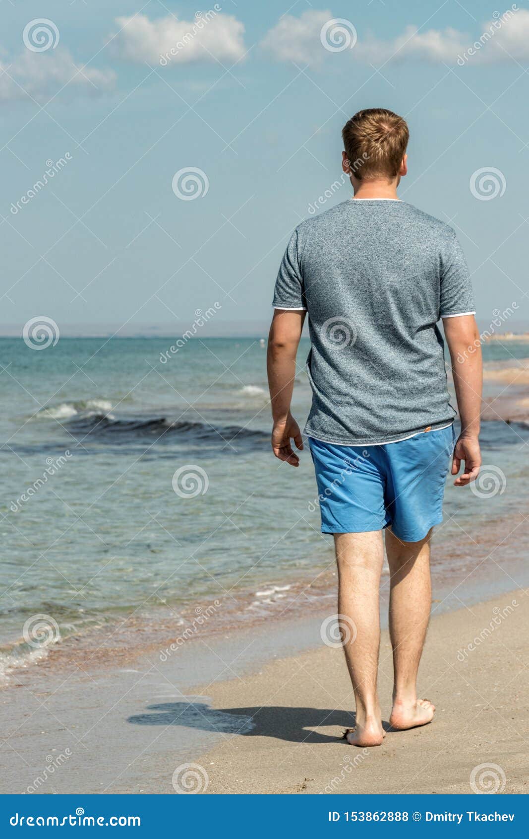 Handsome Man Walking Alone on the Beach with Bare Feet. Rest by the ...