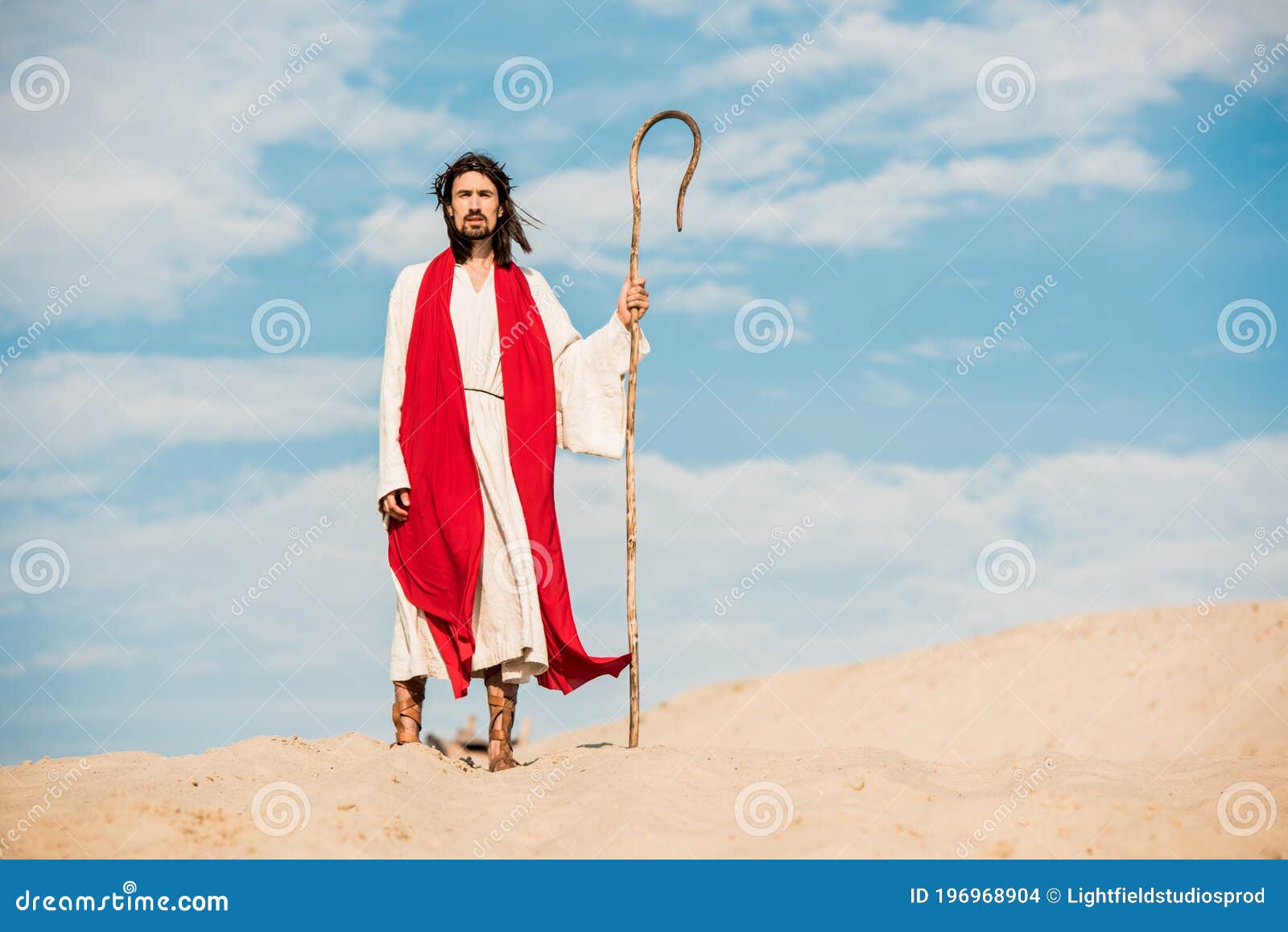 Handsome Man Walking with Wooden Cane in Desert Stock Photo - Image of ...