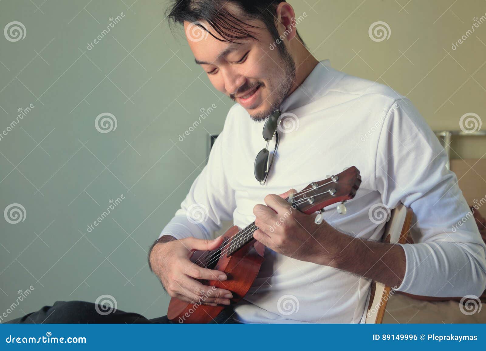Handsome Man Was Playing a Ukulele Enjoyed in the Room Stock Photo ...