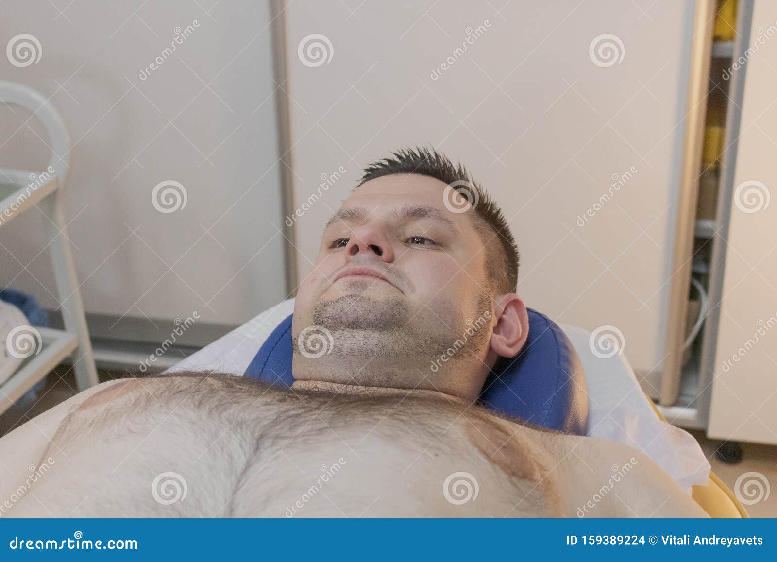 Handsome Man on Waxing Procedure in a Beauty Salon. Stock Photo - Image ...