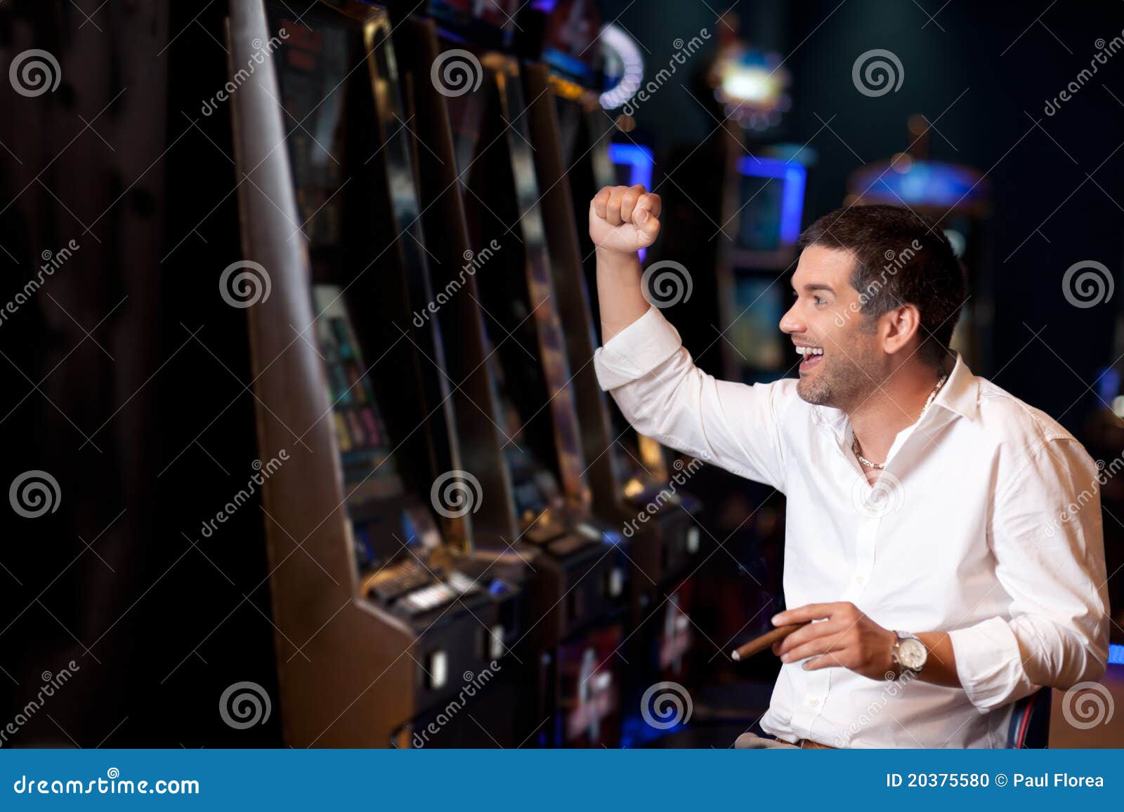 Handsome Man Winning at the Slot Machine Stock Photo - Image of ...