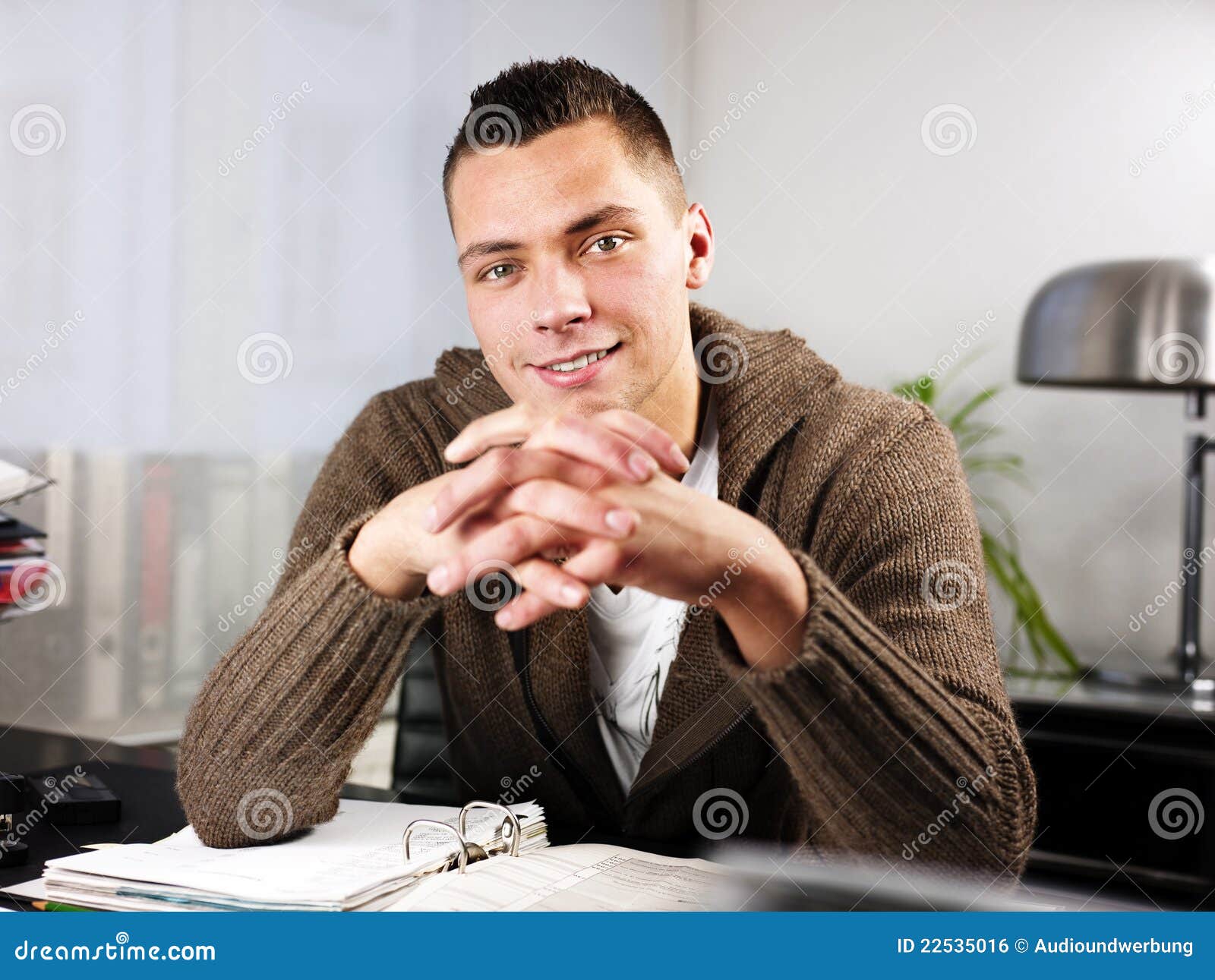 Handsome man at work stock photo. Image of folder, male - 22535016
