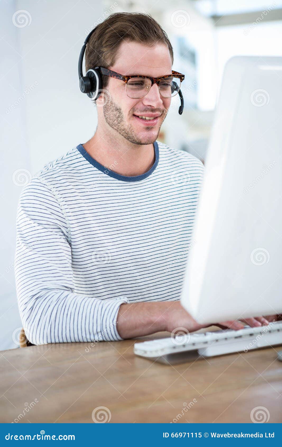 Handsome Man Working on Computer with Headset Stock Image - Image of ...