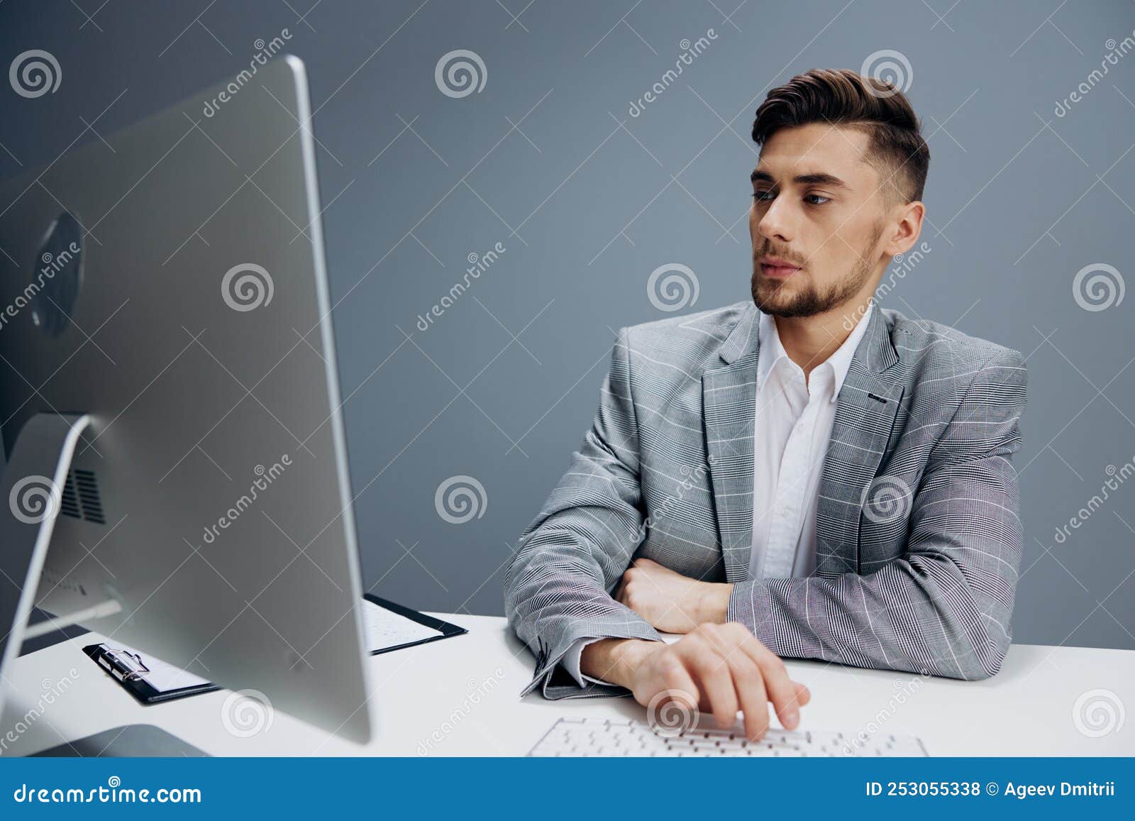 Handsome Man Working at the Computer in the Office Executive Stock ...