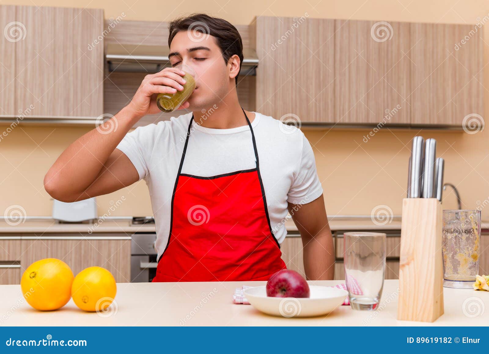 The Handsome Man Working at the Kitchen Stock Photo - Image of drinking ...