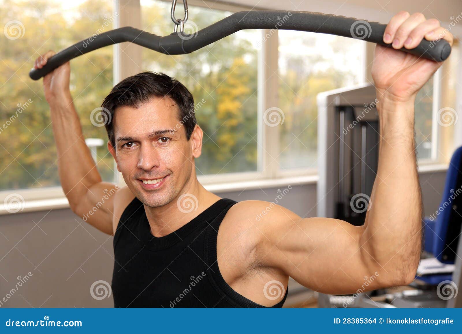 Handsome Man Working Out in a Gym Stock Photo - Image of healthy, club ...