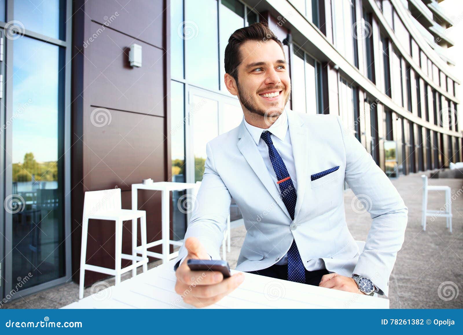 Handsome Man Working with Smartphone and Documents at Outdoors Cafe ...