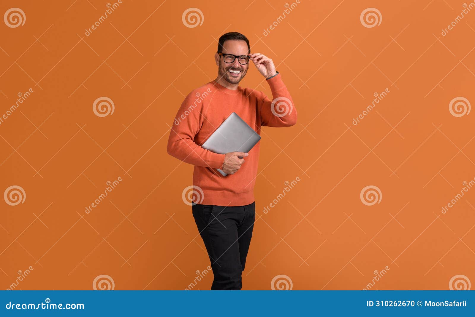 Handsome Manager with Touchpad Smiling and Holding Eyeglasses while ...