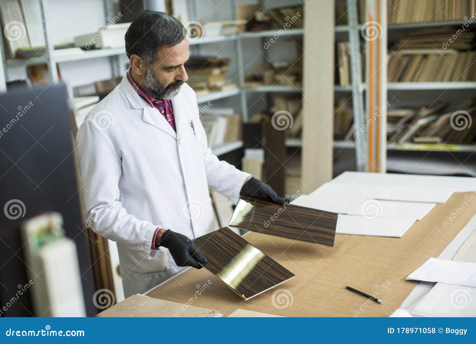 Handsome Mature Engineer in the Laboratory Examines Ceramic Tiles Stock ...