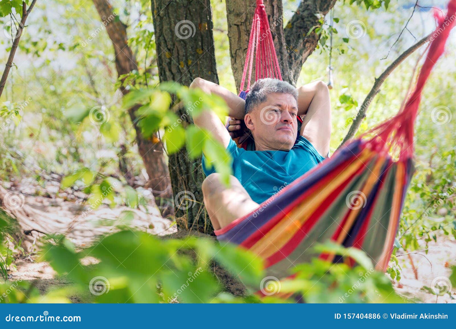 Handsome Mature Man Resting in a Hammock Stock Photo - Image of ...