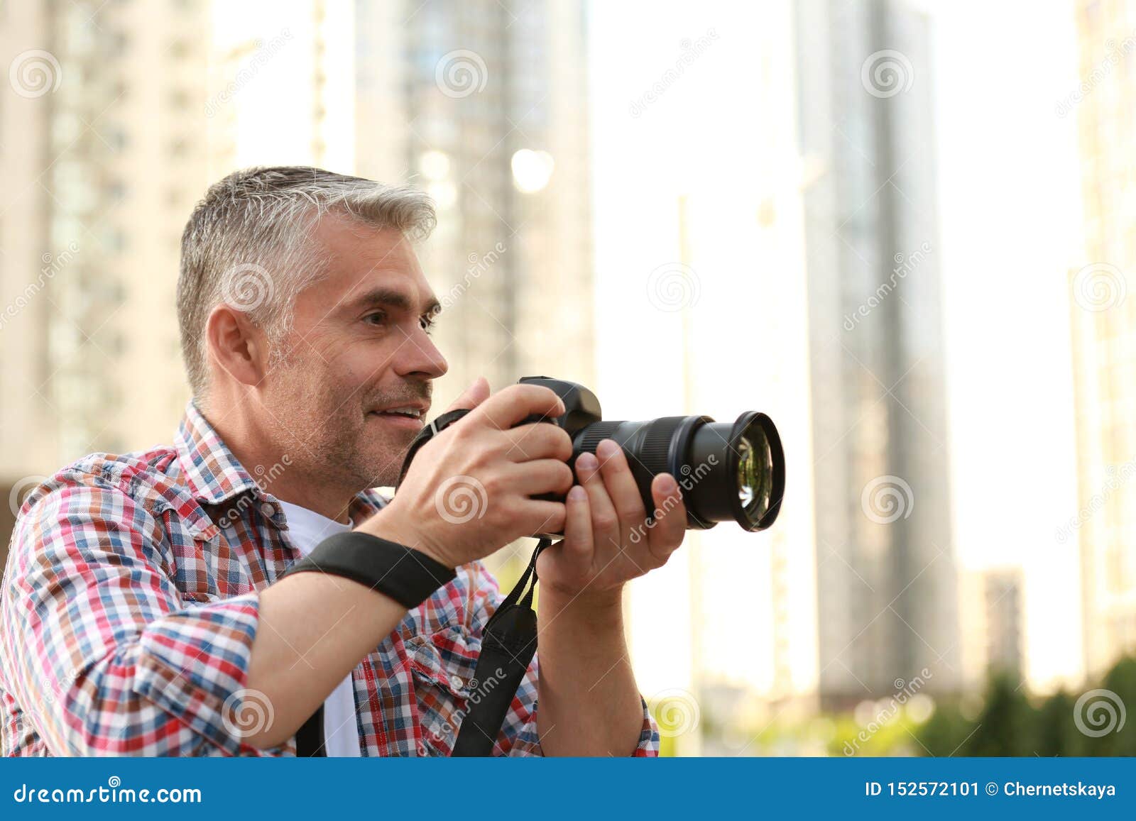 Handsome Mature Man Taking Photo with Professional Camera Outdoors ...