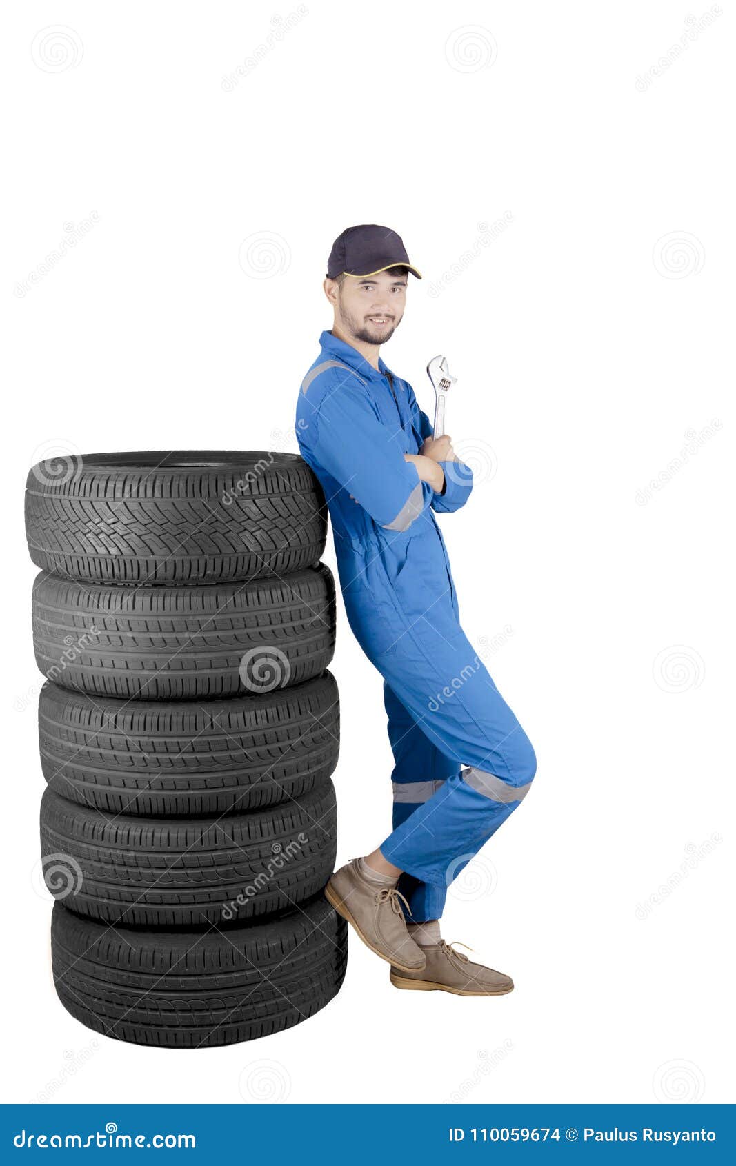 Handsome Mechanic Posing with Stack of Tires Stock Photo - Image of ...