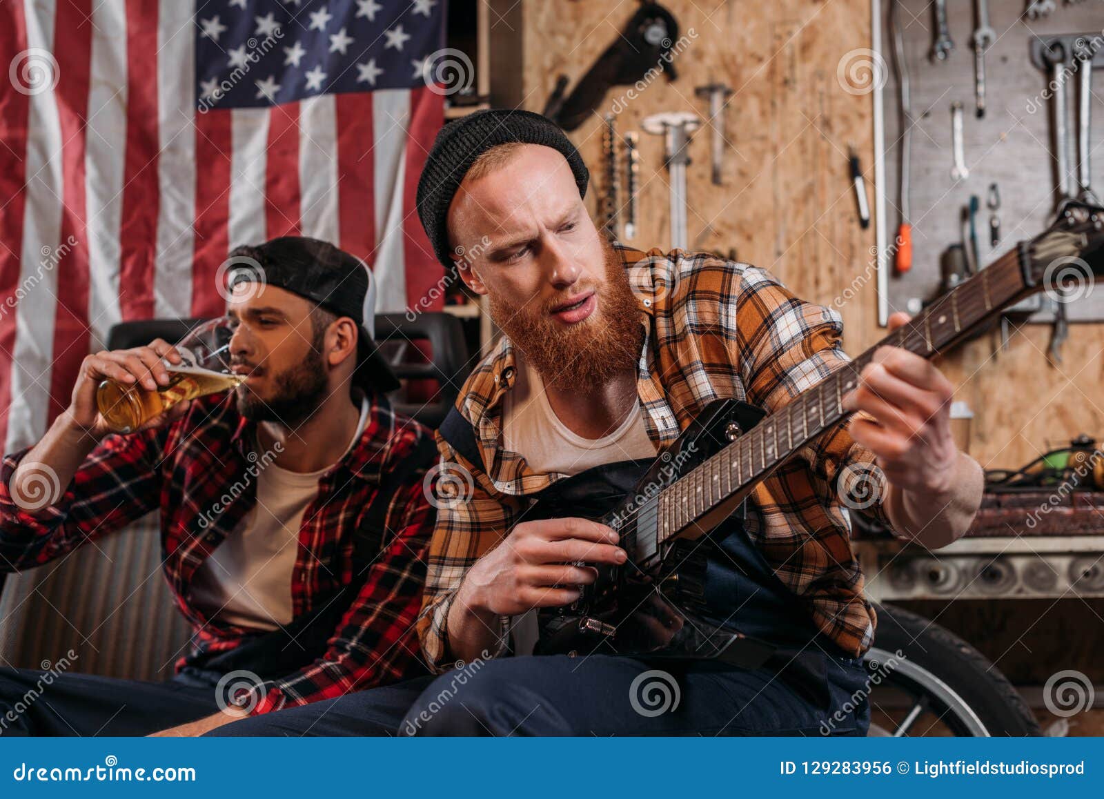 Handsome Mechanics Playing Guitar and Drinking Beer Stock Photo - Image ...