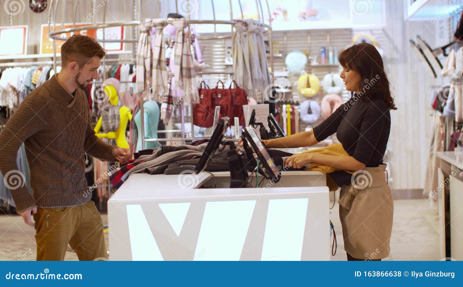 Man Buys a Lot of Clothes in a Store Stock Photo - Image of person ...