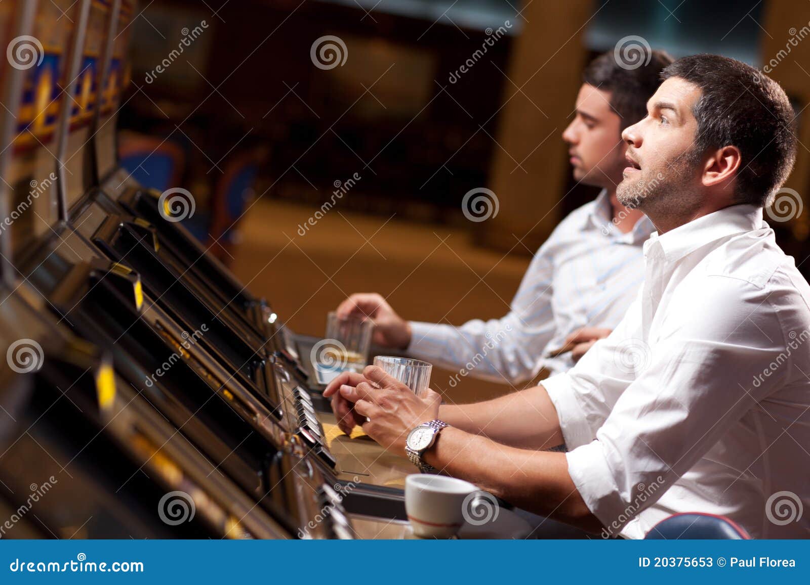 Handsome Men Playing the Slot Machine Stock Image - Image of gambling ...
