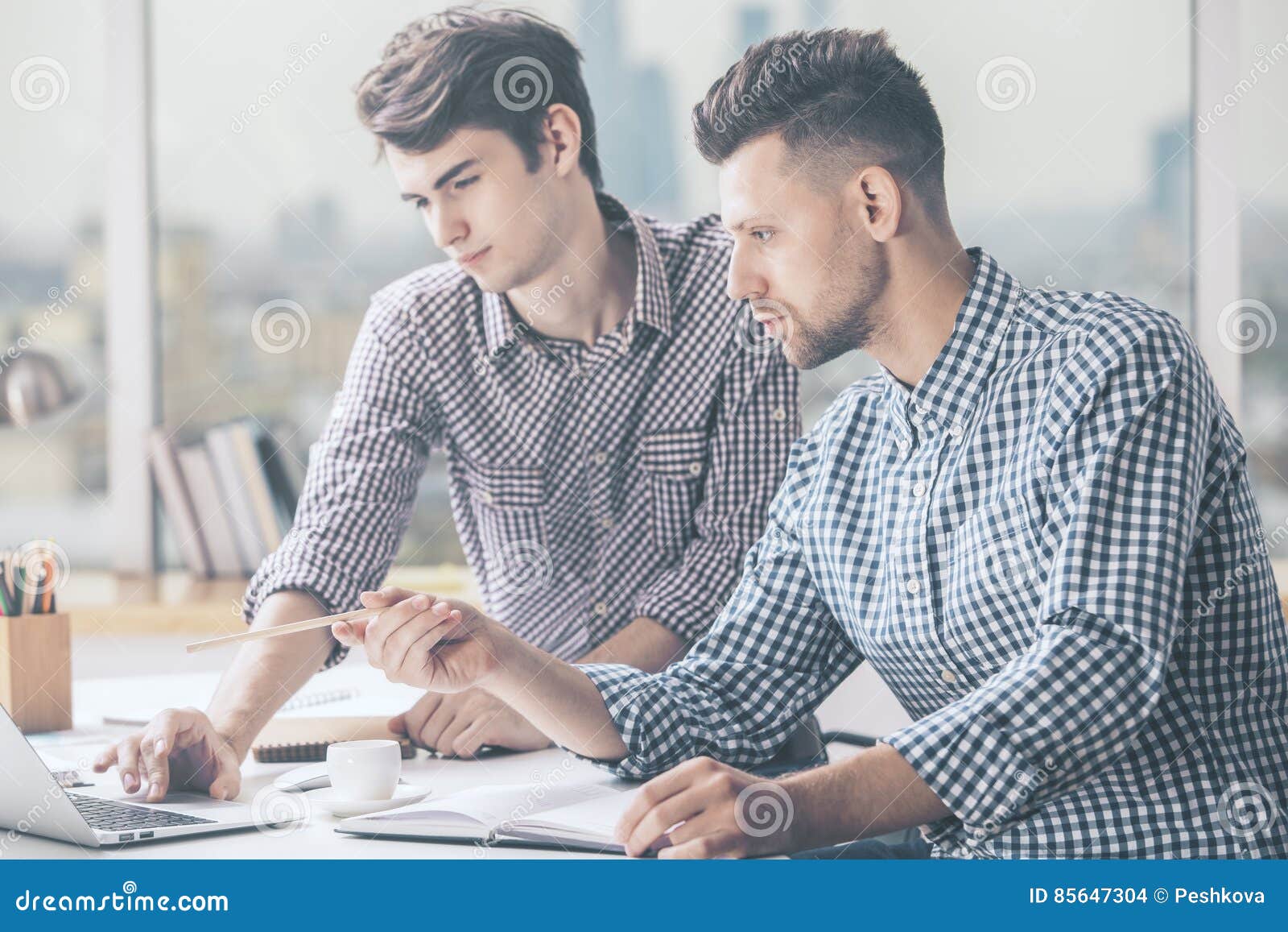 Handsome Men Working on Project Stock Photo - Image of items ...