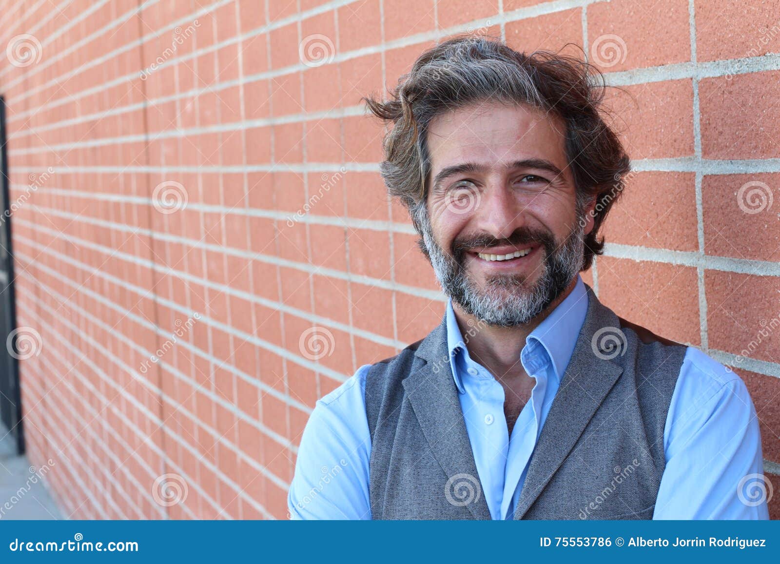 Handsome Middle Age Mediterranean Man in a Studio Portrait on a Red ...