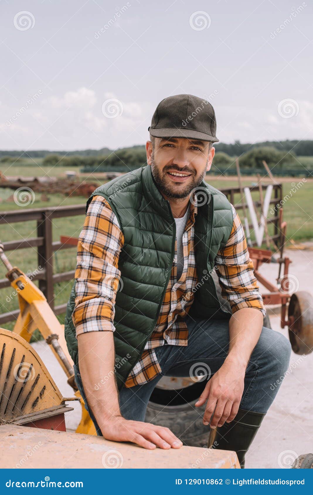 Handsome Middle Aged Farmer in Cap Smiling at Camera while Working ...