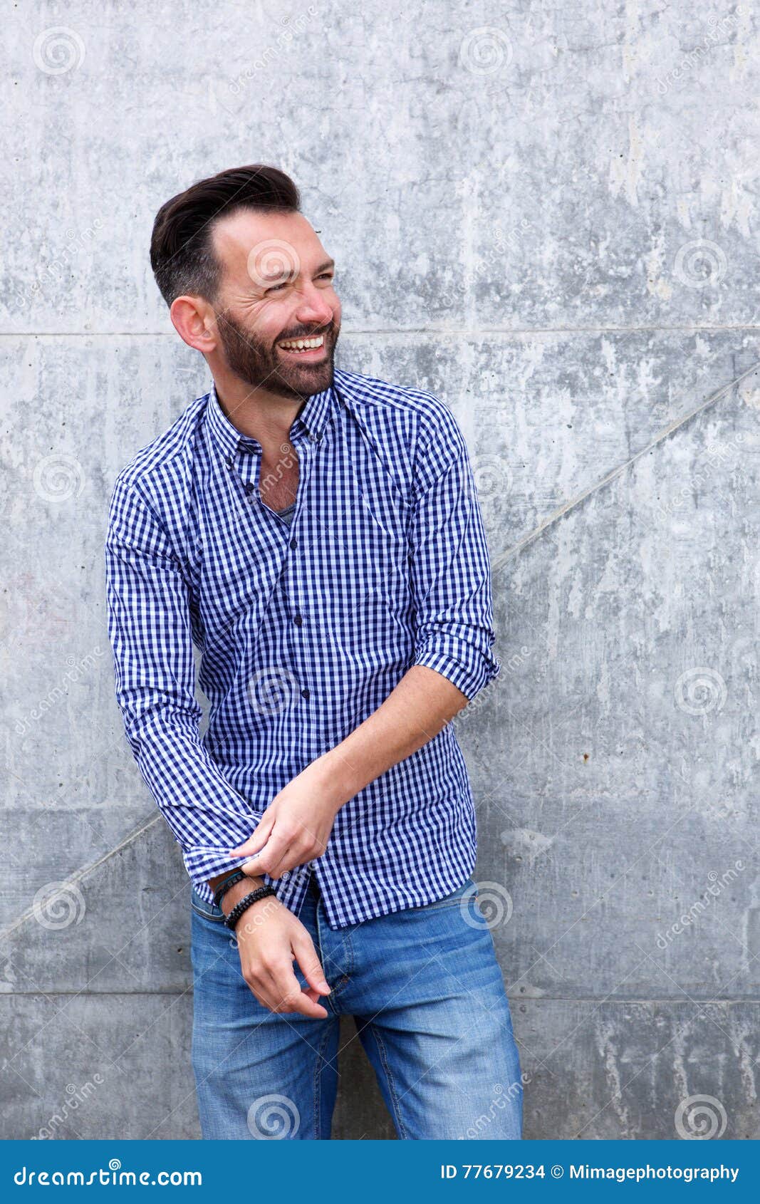 Handsome Middle Aged Guy Standing Against Wall and Looking Away Stock ...
