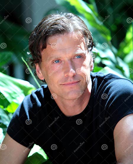 Handsome Middle Aged Man Looking Pensive in the Sun Stock Image - Image ...