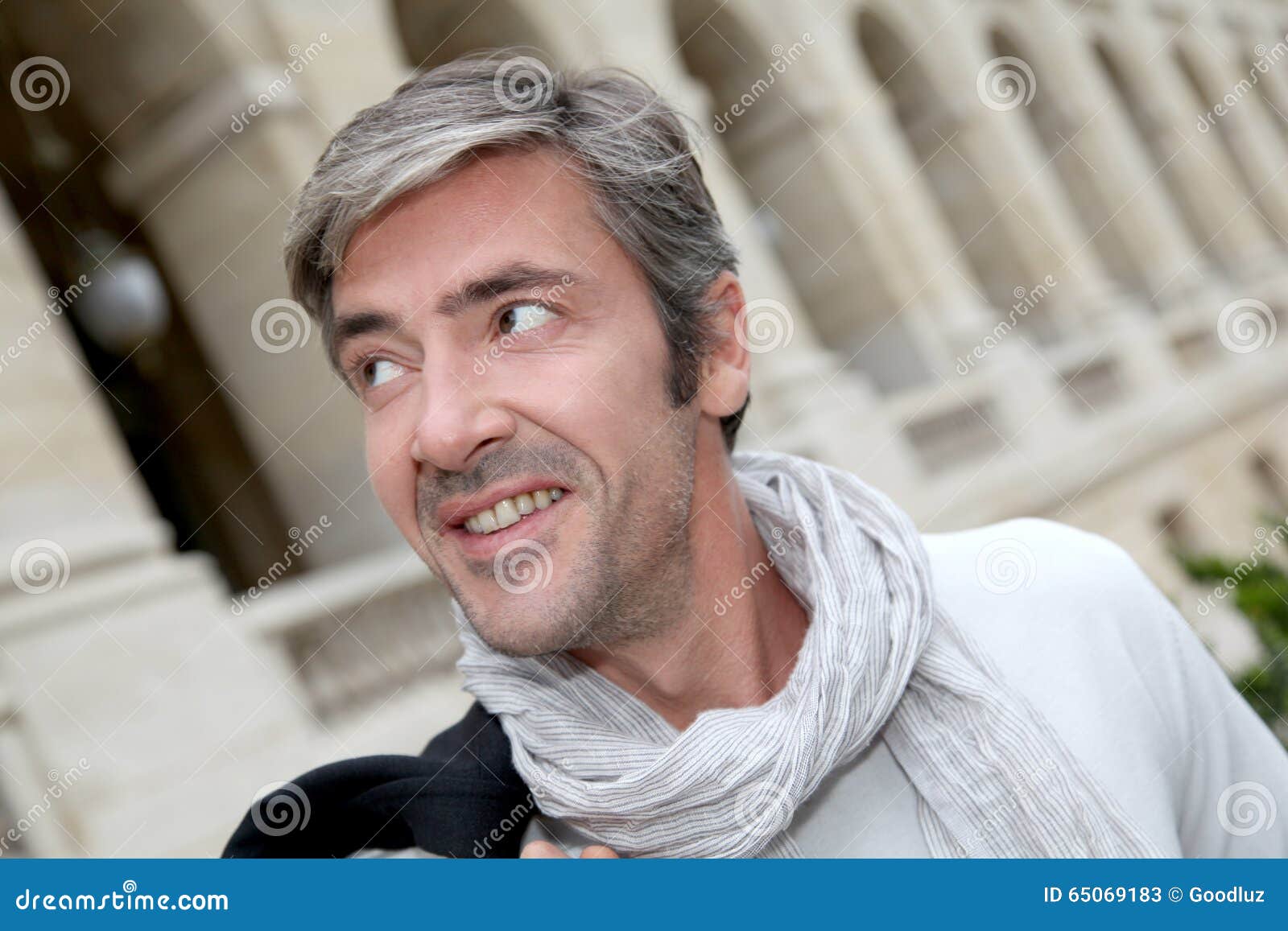 Handsome Middle-aged Man Smiling and Walking in Town Stock Image ...