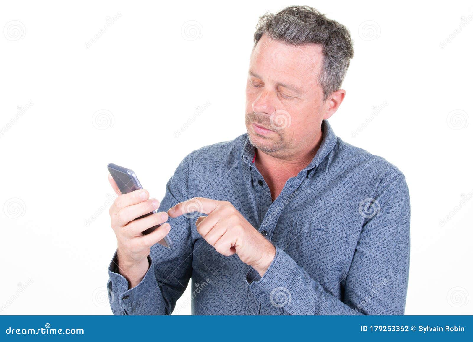 Handsome Middle-aged Man Texting a Message on Cell Smartphone Phone ...