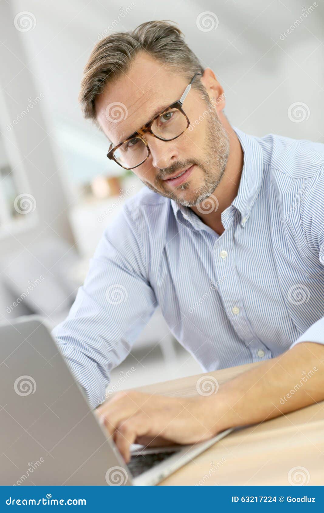 Handsome Middle-aged Man Working on Laptop Stock Photo - Image of ...
