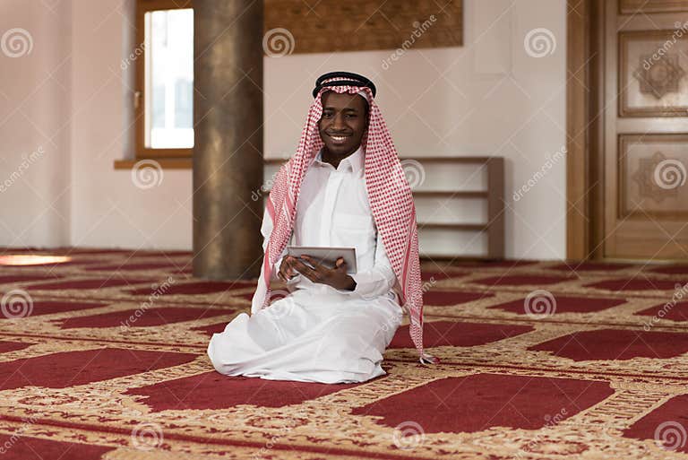Handsome Middle Eastern Man Using a Touchpad Stock Image - Image of ...