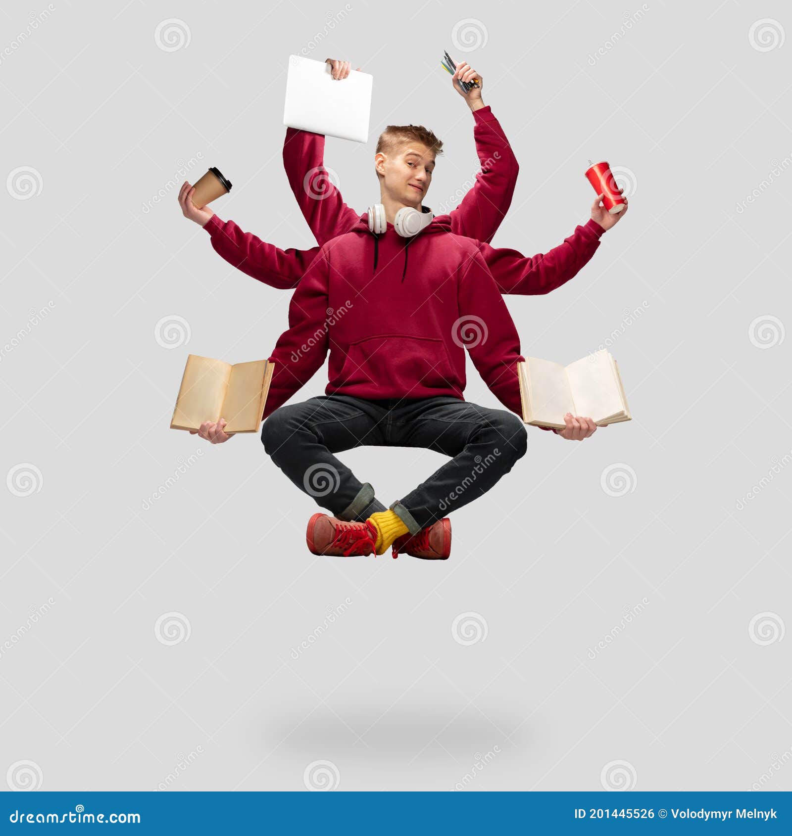Handsome Multi-armed Student Levitating on Grey Studio Background with ...