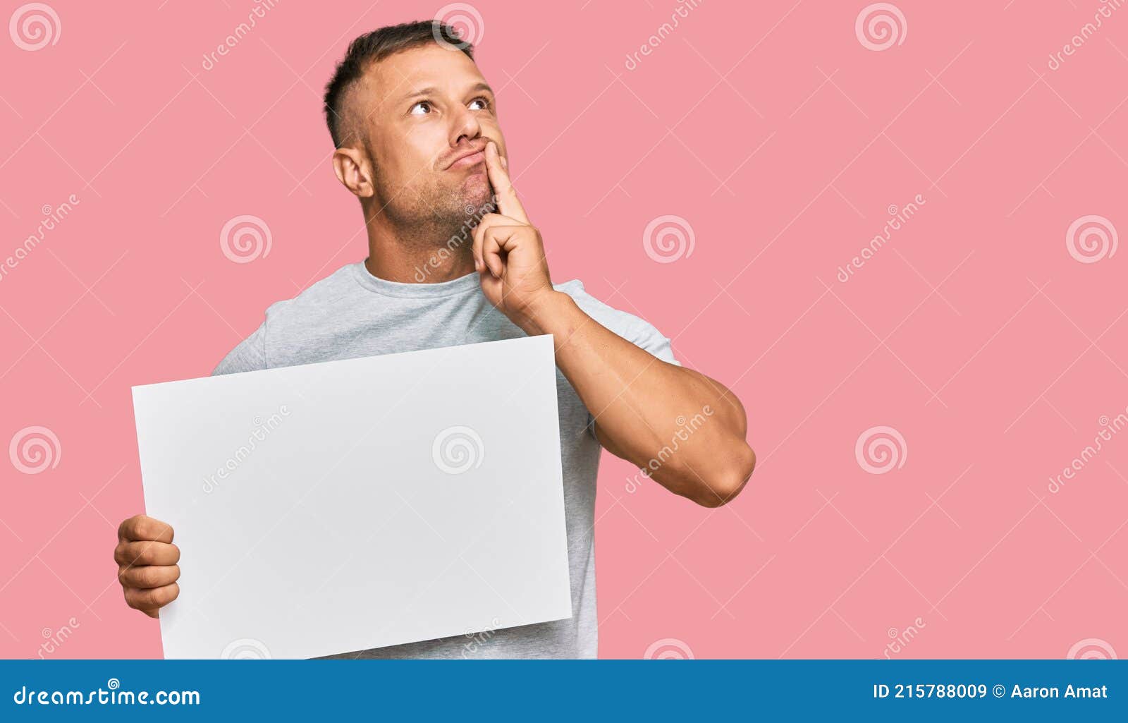 Handsome Muscle Man Holding Blank Empty Banner Serious Face Thinking ...