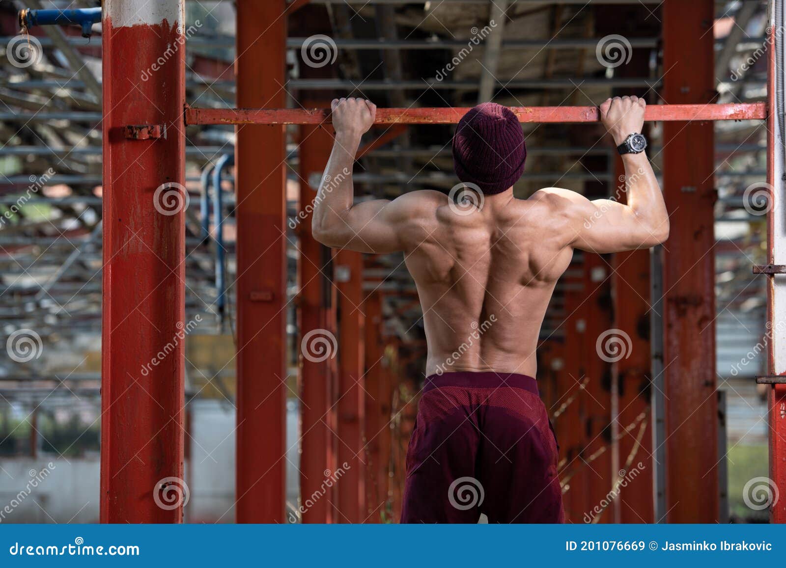 Male Athlete Doing Pull Ups in Warehouse Stock Image - Image of ...