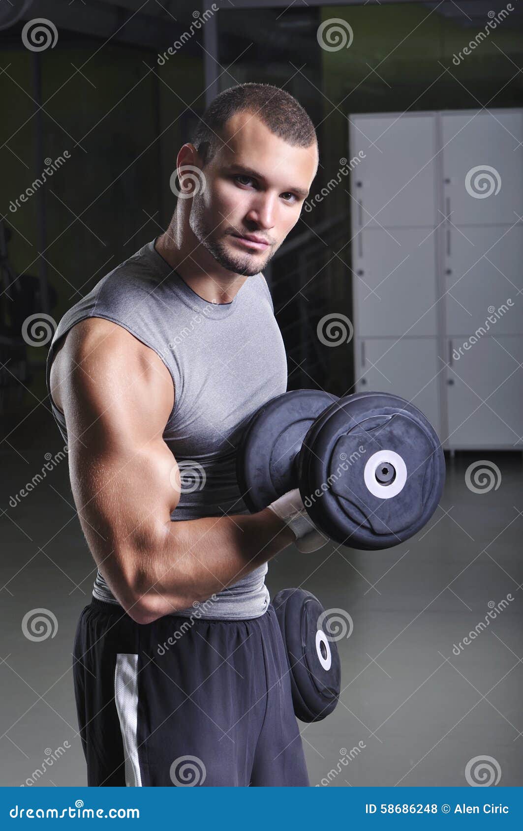 Handsome Muscular Male Model Doing Biceps Exercise Stock Photo - Image ...