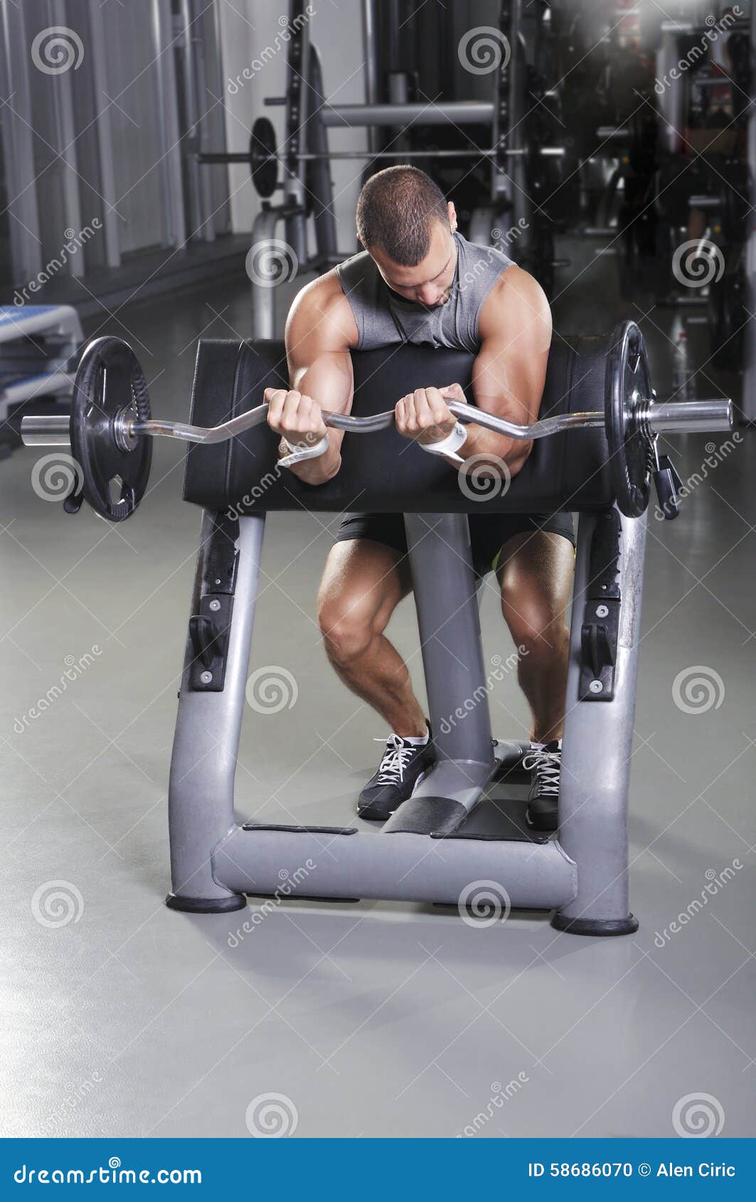 Handsome Muscular Male Model Doing Biceps Exercise Stock Photo - Image ...