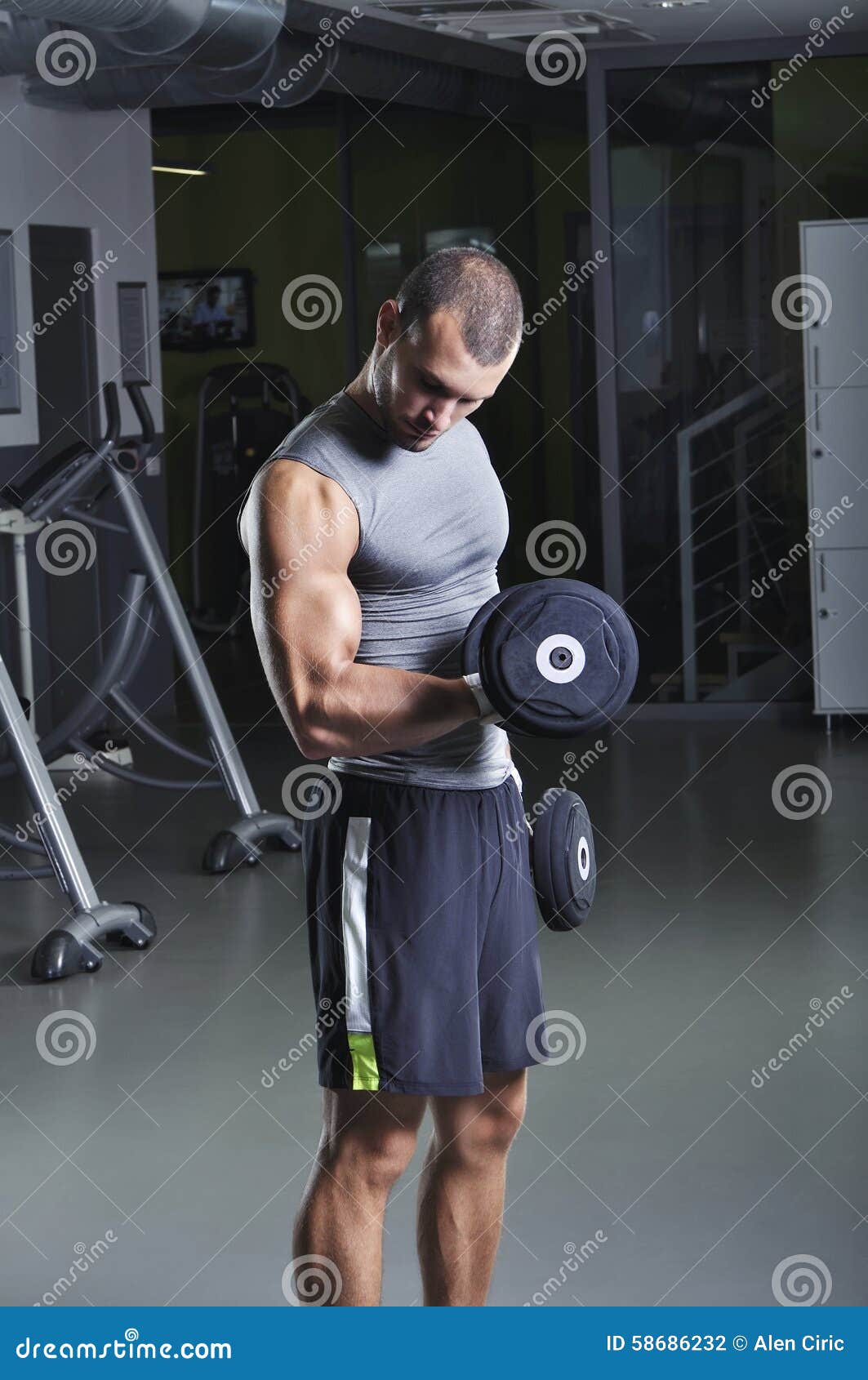 Handsome Muscular Male Model Doing Biceps Exercise Stock Photo - Image ...