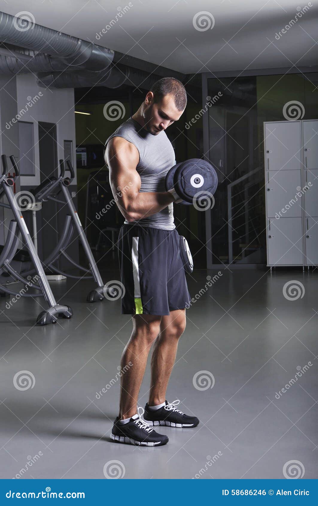Handsome Muscular Male Model Doing Biceps Exercise Stock Photo - Image ...